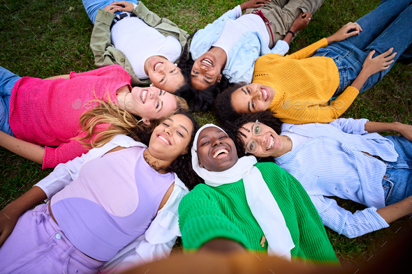 Selfie of multiracial group young female community friends lying in ...