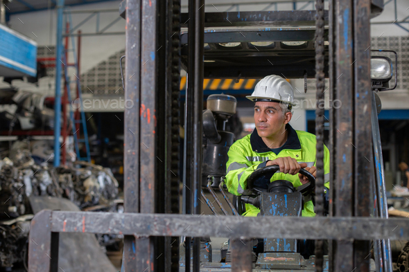 Man wear safety helmet driver forklift warehouse in factory. Male ...