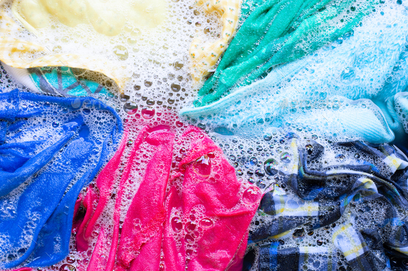 Washing clothes, colorful clothes soaked. Stock Photo by bowonpats