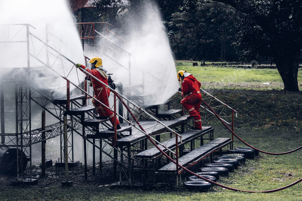 Firefighter Concept. Several firefighters go offensive for a fire ...
