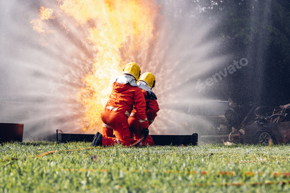 Firefighter Concept. Several firefighters go offensive for a fire ...