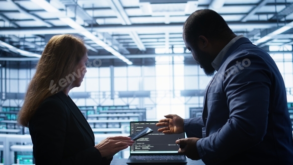 Coworkers in data center replacing storage rigs parts to improve performance Stock Photo by DC ...