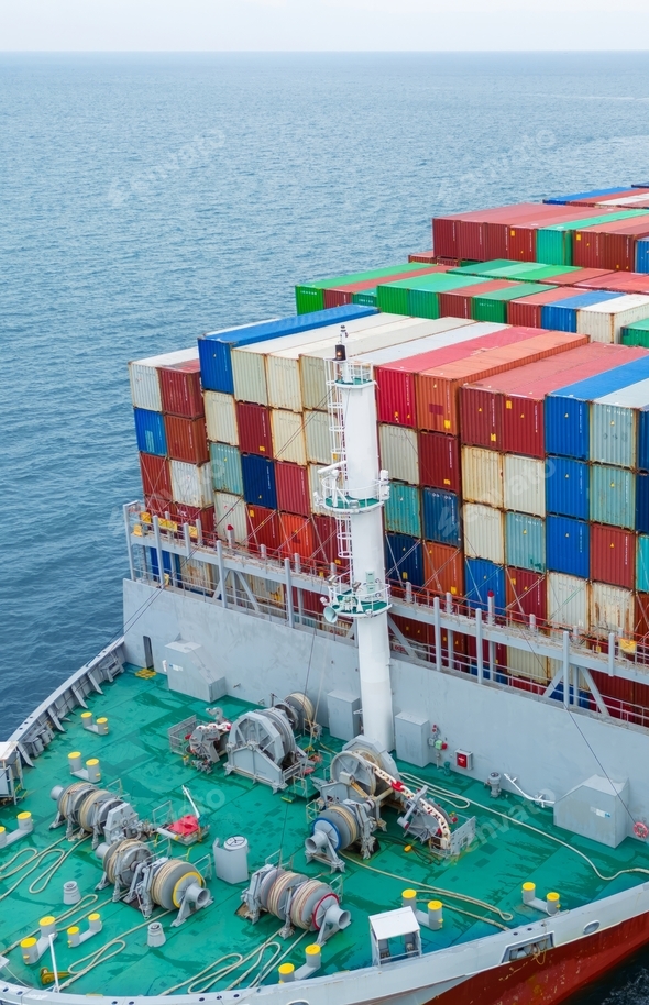 Portrait view Cargo container ship carrying container and running Stock ...