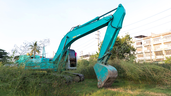 The excavator digs a soil. Digger loading trucks with soil Stock Photo ...