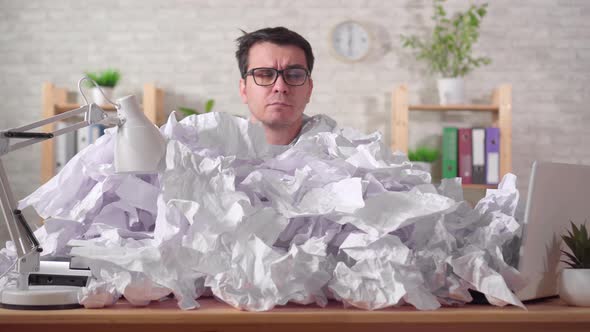 Perplexed Man Office Worker with Glasses in a Heaps of Paper on the ...