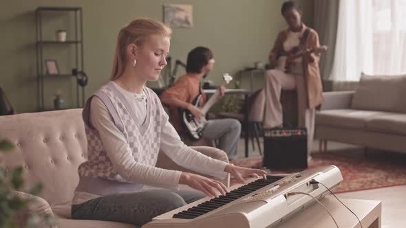 Young Woman Playing Keyboard in Music Band, Stock Footage | VideoHive
