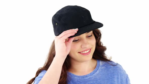 Beautiful woman adjusting cap, Stock Footage | VideoHive