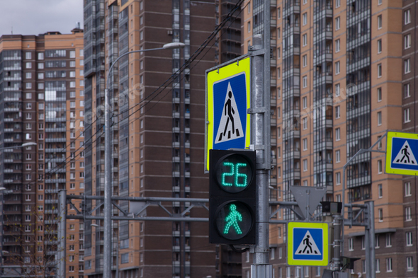 Road signs and symbols for pedestrian crossings. Traffic light with ...