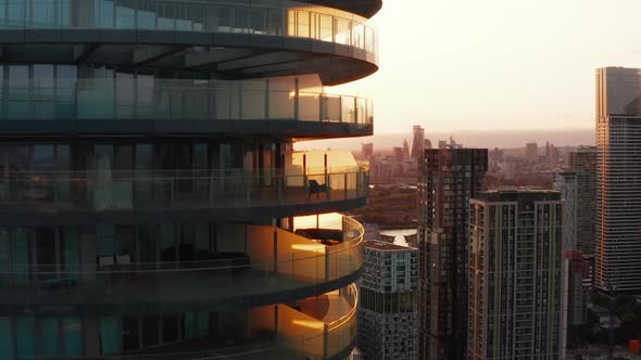 Ascending Shot of Tall Modern Round Apartment Building with Rings of ...