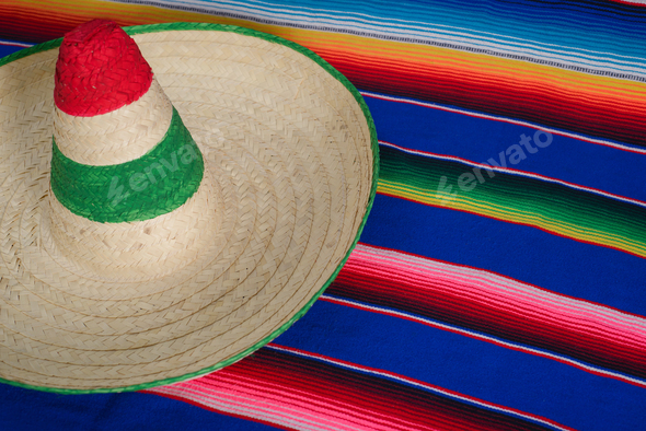 Mexican hats with the colors of the Mexican flag on a colorful serape ...