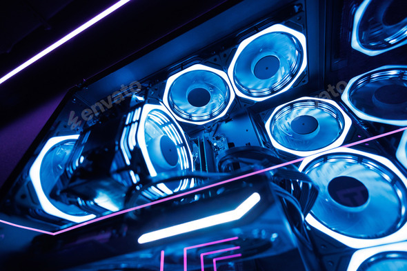 Gaming computer with light. Components of a liquid-cooled computer with ...