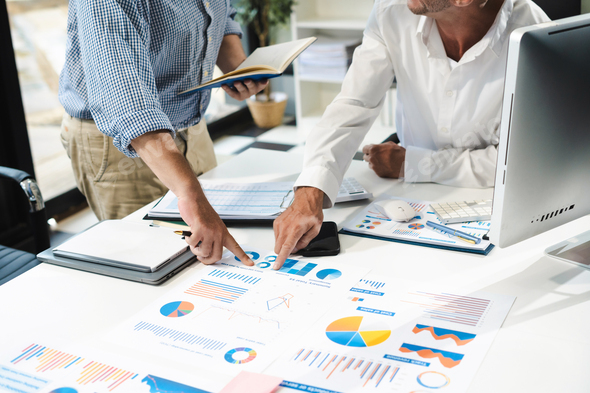 Male colleague caucasian working and update tasks with milestones ...