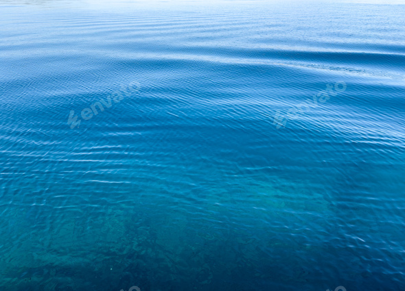 Ocean sea water surface calm with ripple, shades of blue background ...