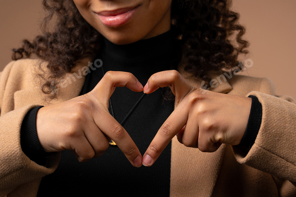 Teenager zoomer girl showing sign of shape heart. Positive lady on ...