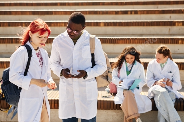 Medical Students in Medical Scrubs with Skeleton Model Studying ...
