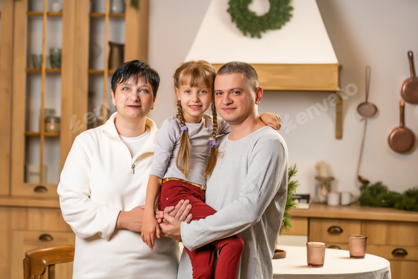 The young happy family is getting ready for the Christmas and Advent ...