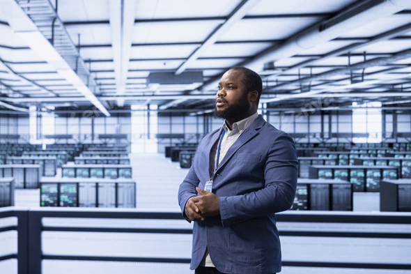 Engineer in data center solving technical errors related to data center equipment Stock Photo by ...