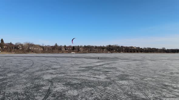 wind surfing over a frozen lake, winter sports in Minnesota, explore ...