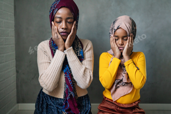 Muslim family praying together. Religious activity concept Stock Photo ...