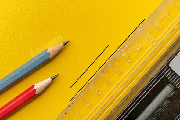 drawing a line on a color surface with a ruler and a pencil Stock Photo ...