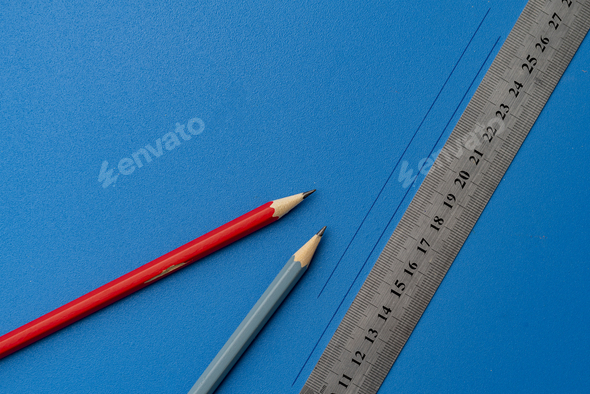 drawing a line on a color surface with a ruler and a pencil Stock Photo ...