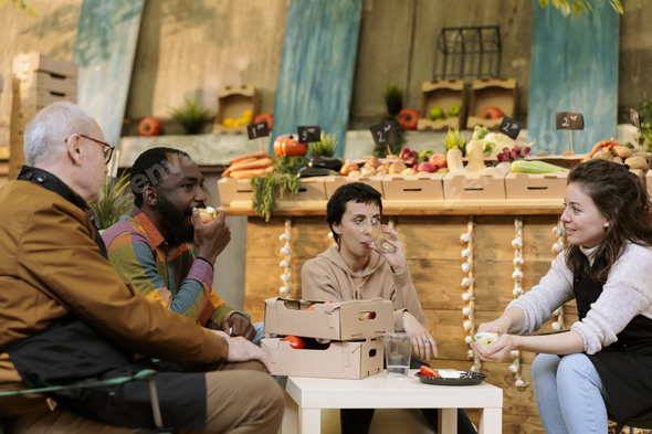 People sampling fresh fruits and veggies Stock Photo by DC_Studio ...