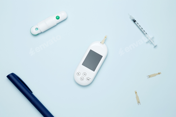 Diabetes concept with glucometer, syringe pen with insulin, blood test ...