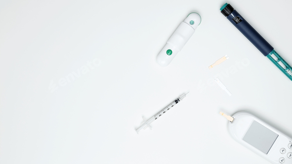 Diabetes concept with glucometer, syringe pen with insulin, blood test ...