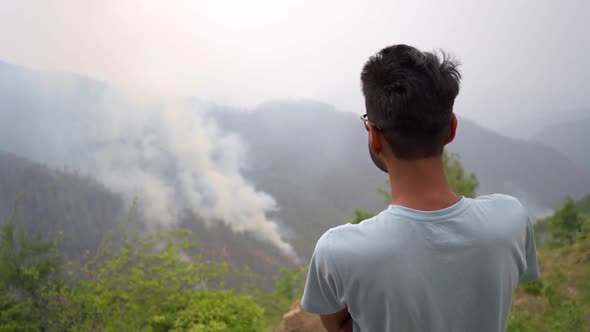 Indian man watching Forest Fire, Stock Footage | VideoHive