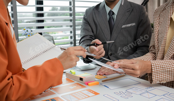 Creative Team Collaborates On Ux Ui Design Project In Modern Office