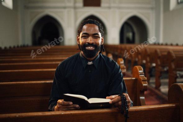 Happy priest smiling sitting on church bench holding rosary beads and ...