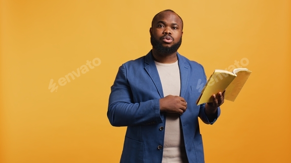Person presenting literature novel, reciting from pages, studio ...