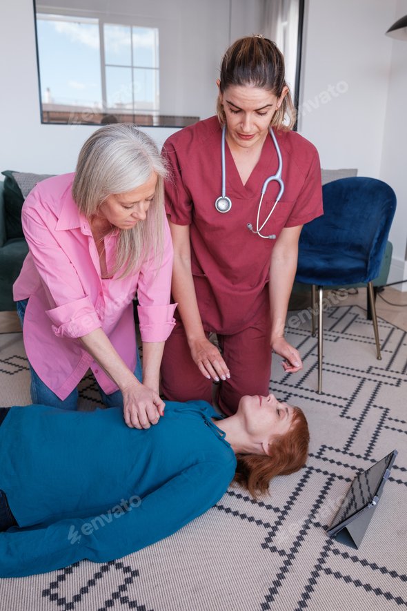 Nurse teaching first aid maneuvers in courses for seniors. Concept ...