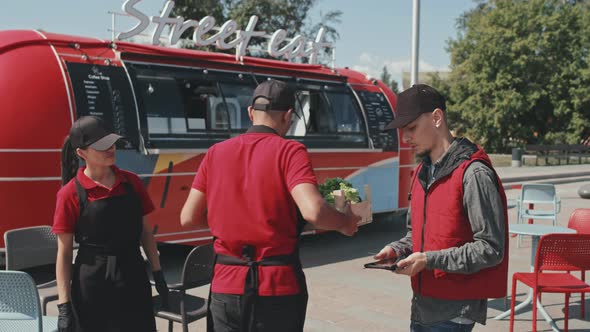 Food Truck Workers Getting Delivery of Fresh Vegetables, Stock Footage