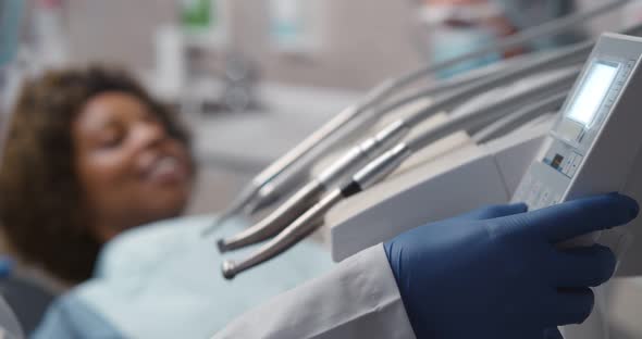 Close Up of Dentist Pushing Button on Control Panel on Dental Chair ...