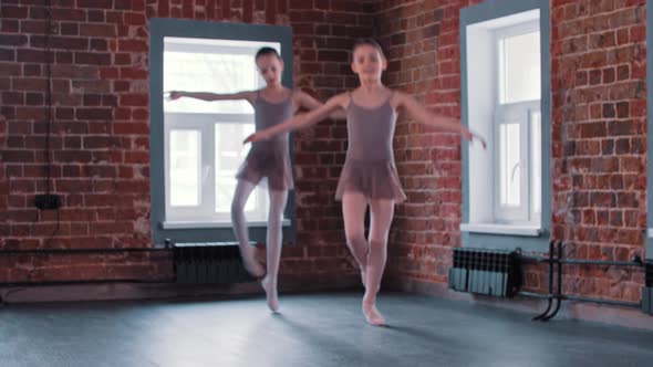 Two Ballerina Girls Synchronized Dancing in the Studio, Stock Footage