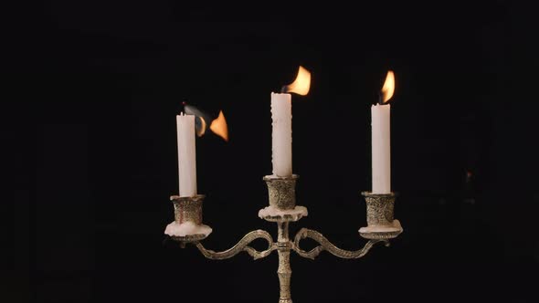 3 Burning Candles in a Candlestick, Stock Footage | VideoHive