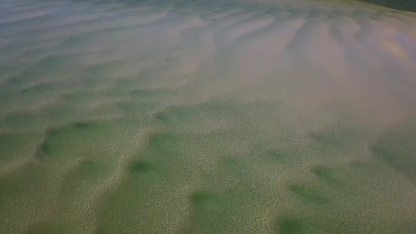 Sand dune patterns under the shallow water of lagoon, Knysna aerial ...