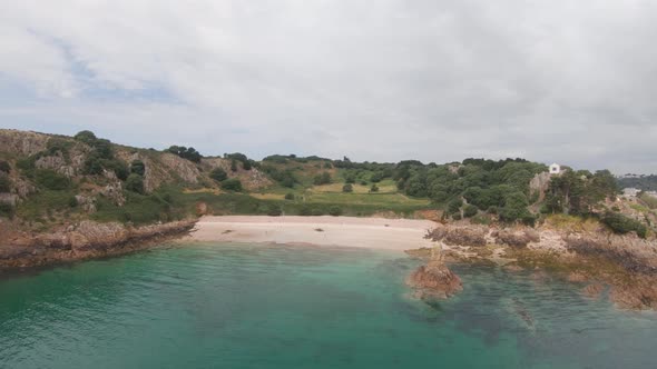 4k Drone aerial footage of a fly towards Beauport beach in Jersey ...