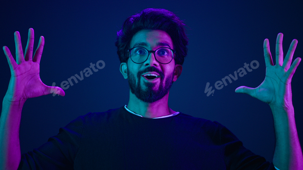 Male portrait neon ultraviolet background Arabian man Indian guy coder ...