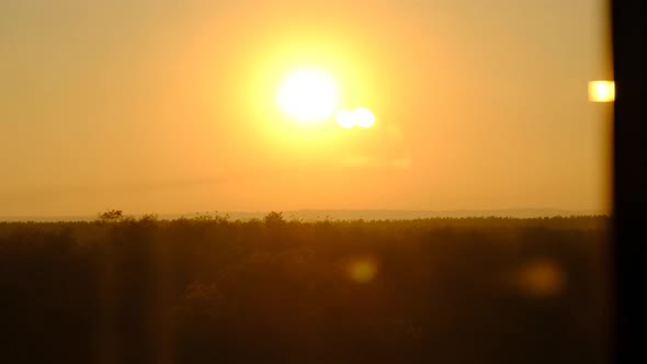 Sunset in the Sky Over Horizon Big Bright Yellow Sun Moves Down Above ...