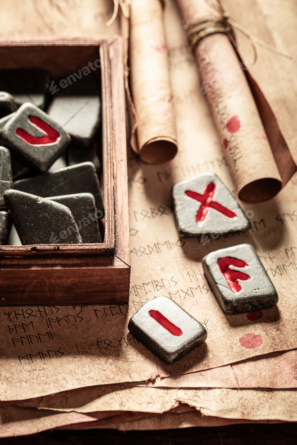 Black rune stones omen based on futhark alphabet Stock Photo by Shaiith