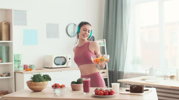 Cheerful Sporty Woman Cooking Breakfast, Stock Footage | VideoHive