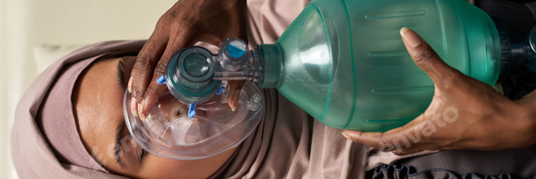 Administering CPR Using Breathing Apparatus Stock Photo by Pressmaster