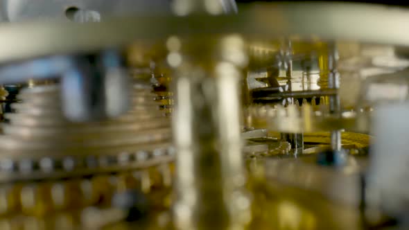 Inside View of Moving Clockwork of Golden Mechanical Clock, Stock Footage