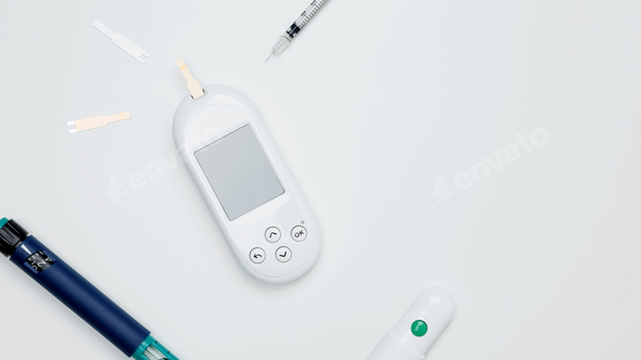 Diabetes concept with glucometer, syringe pen with insulin, blood test ...