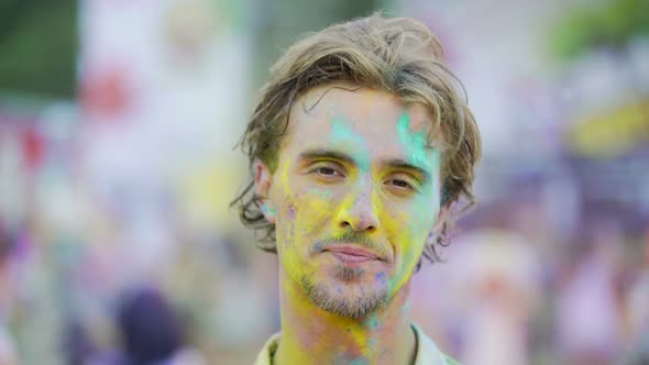 Happy Male Face Covered in Coloured Powder Closeup, Young Man Smiling ...