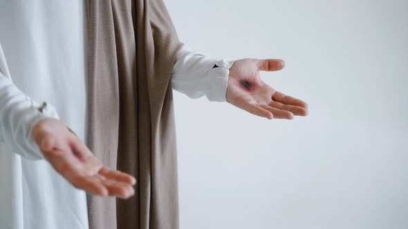 Jesus' Hands with Stigmata on a White Background, Stock Footage | VideoHive