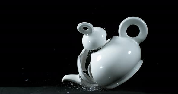 Tea-Pot falling and exploding on Black Background, Slow Motion 4K ...