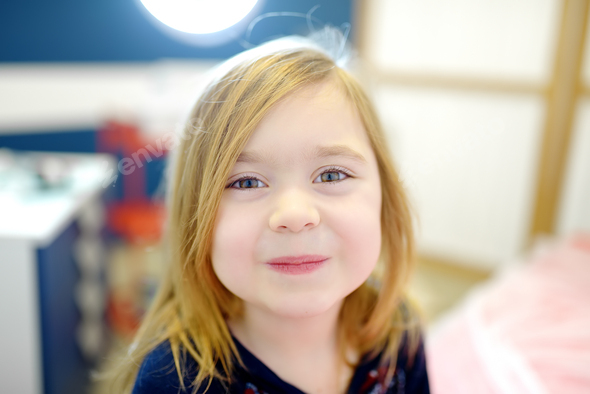 Portrait of cute little girl is during visit to medical clinic Stock ...